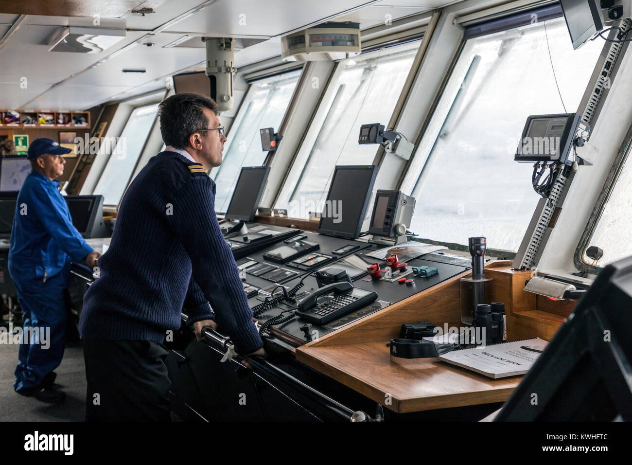 Ship's crew on bridge sailing passenger ship Ocean Adventurer; carries ...