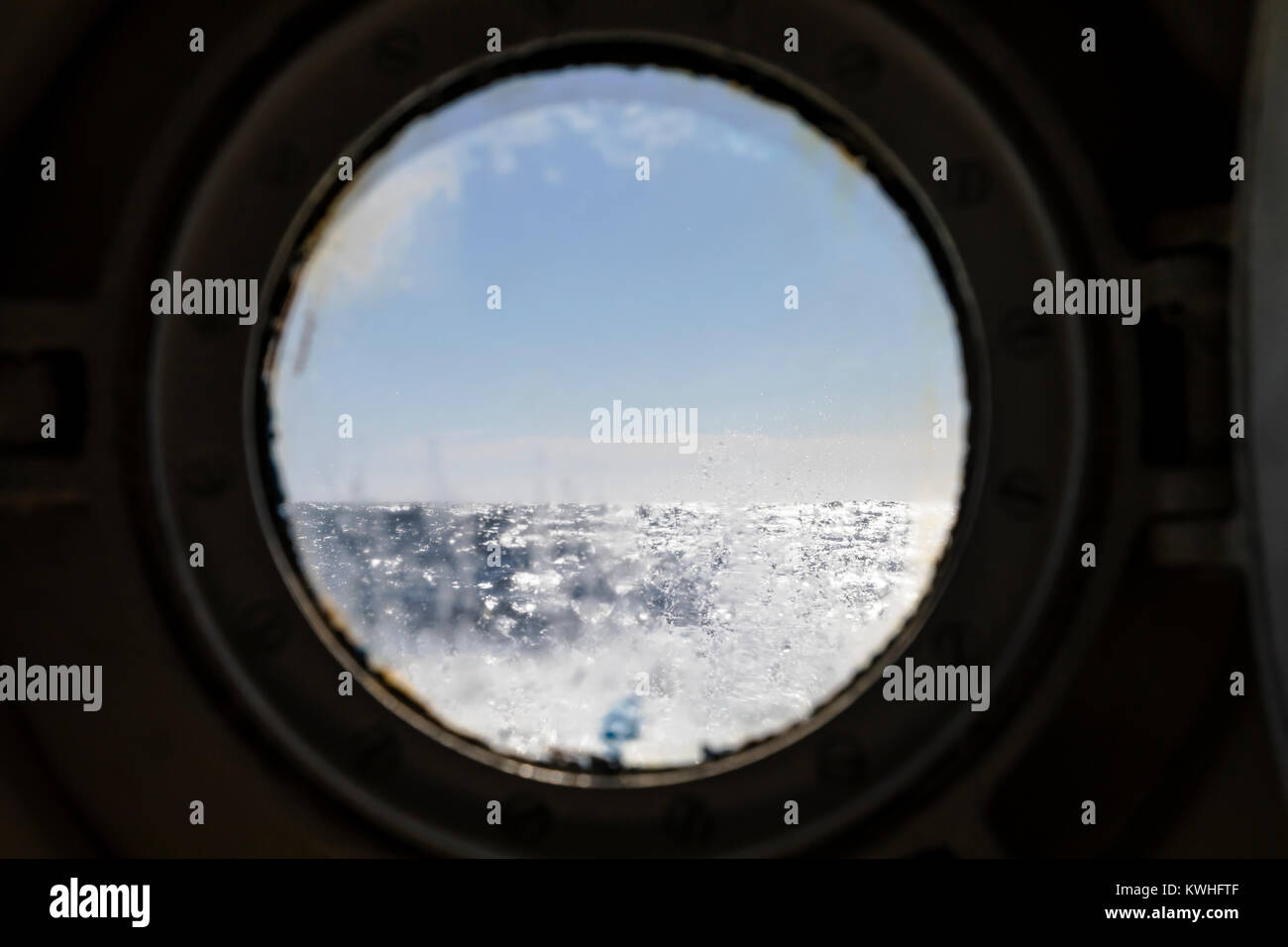 Ocean Adventurer ship port hole view of rough Drake Passage; Pasaje de ...