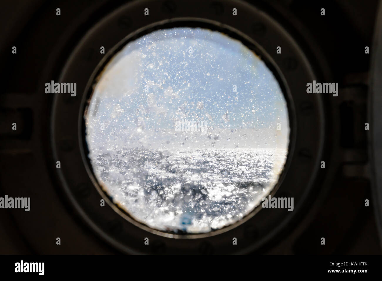 Ocean Adventurer ship port hole view of rough Drake Passage; Pasaje de ...