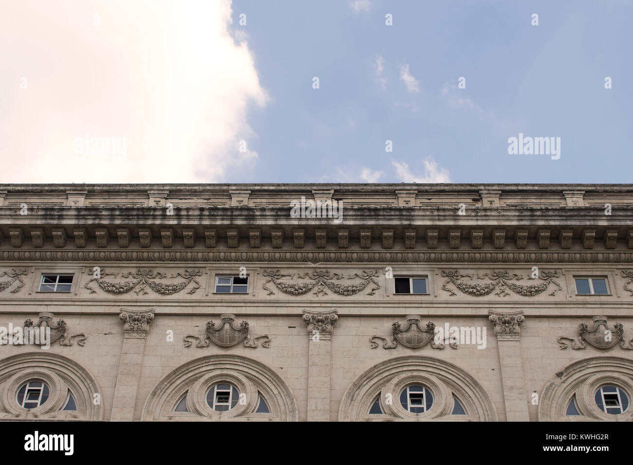 View of late 19th century historical, old building with cloudy blue sky ...