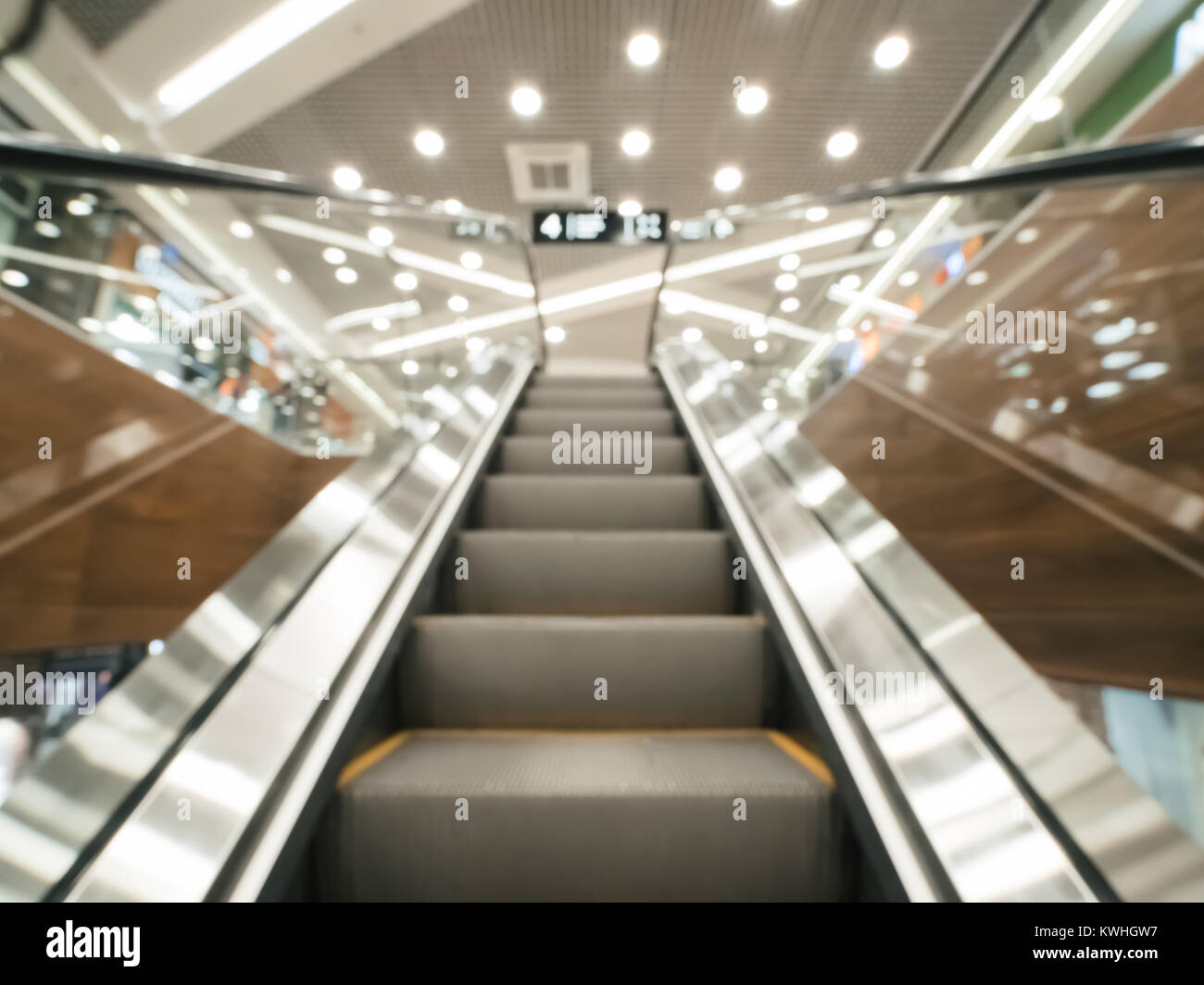 Blurred escalators at modern shopping mall Stock Photo - Alamy