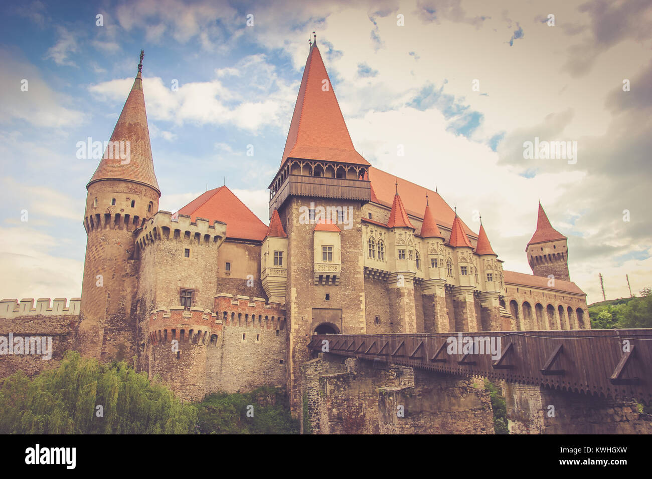 Corvin Castle in Hunedoara, Romania with cloudy blue sky background ...