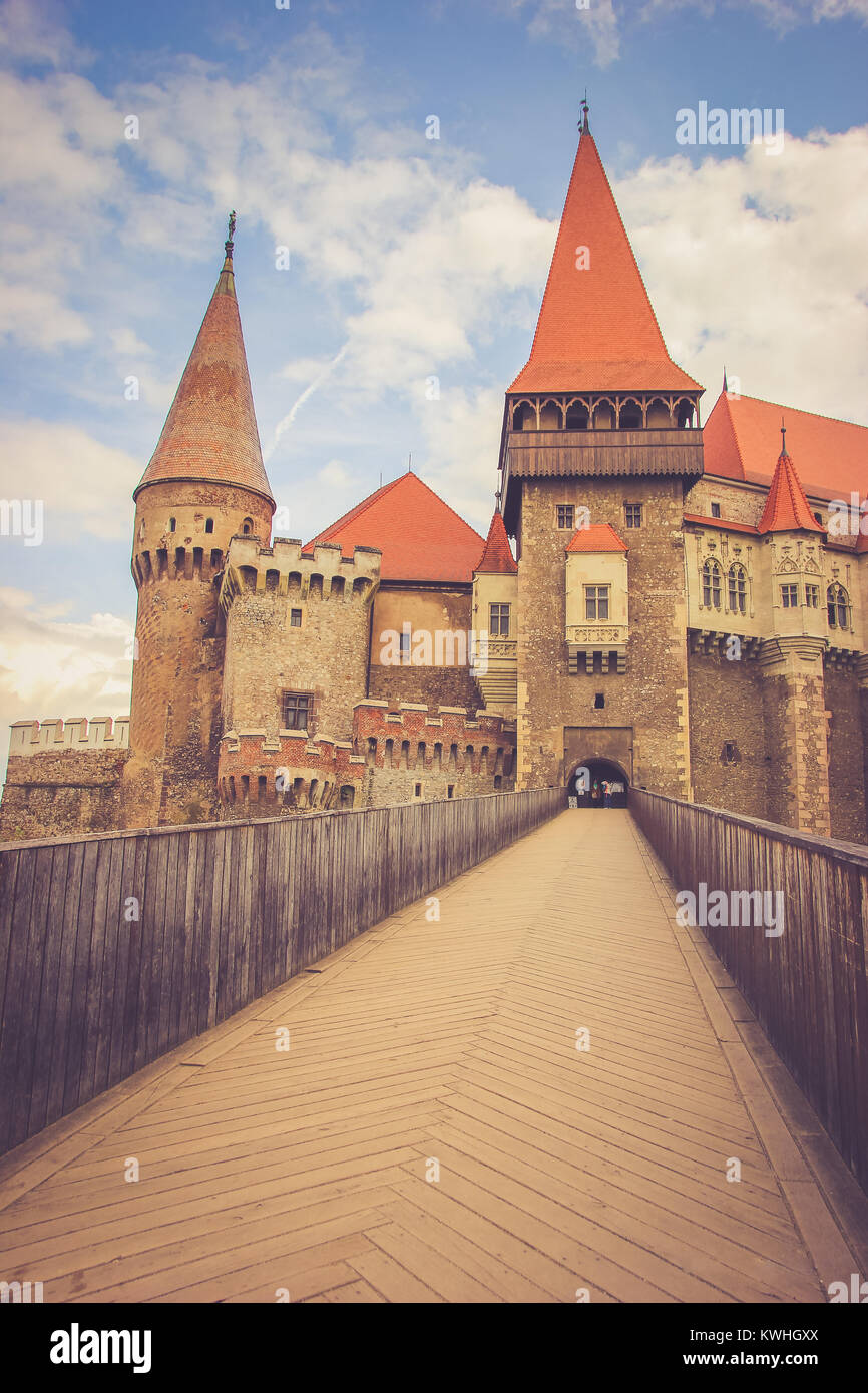 Corvin Castle in Hunedoara, Romania with cloudy blue sky background ...
