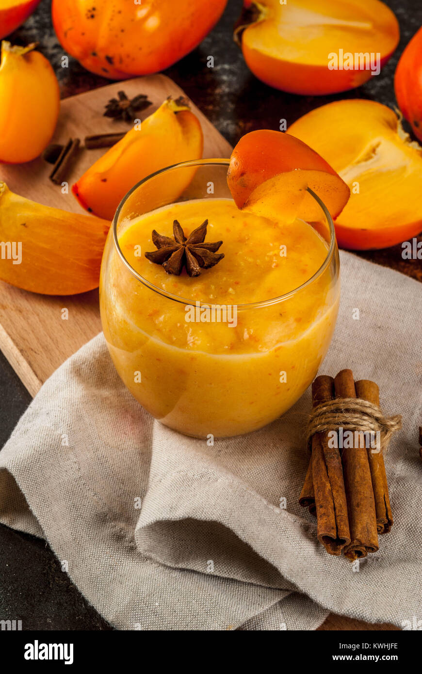 Persimmon fruit smoothie with cinnamon and anise stars, dark rusty ...