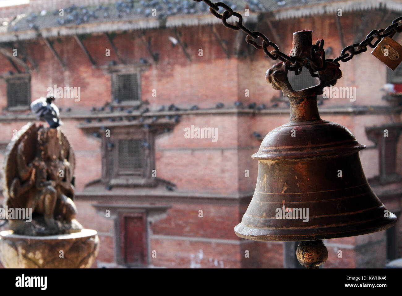 Bronze bell and doves on the Durbar square in Khatmandu, Nepal Stock ...