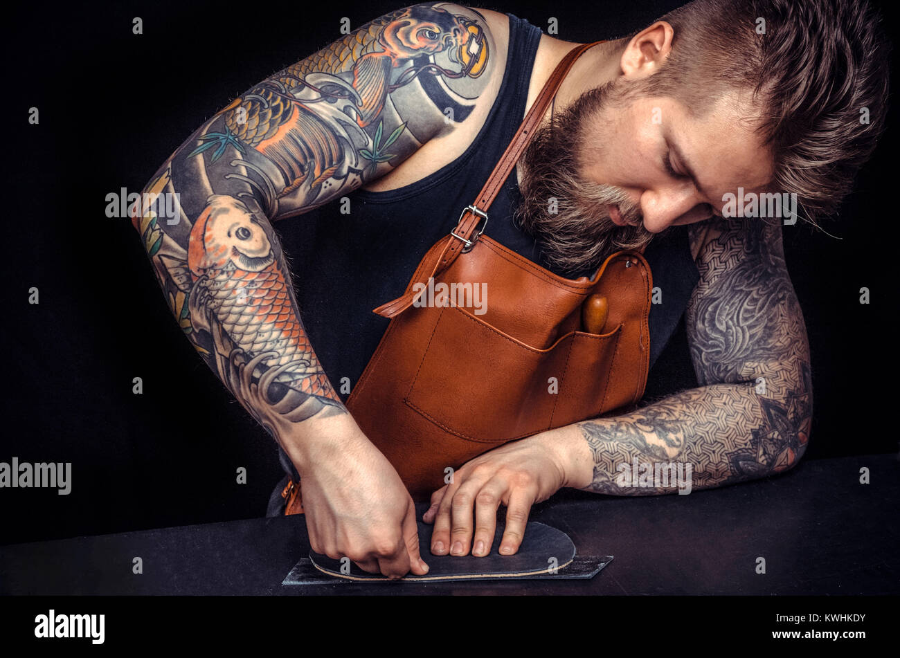 Handicraftsman creates quality product of leather in leather studio ...