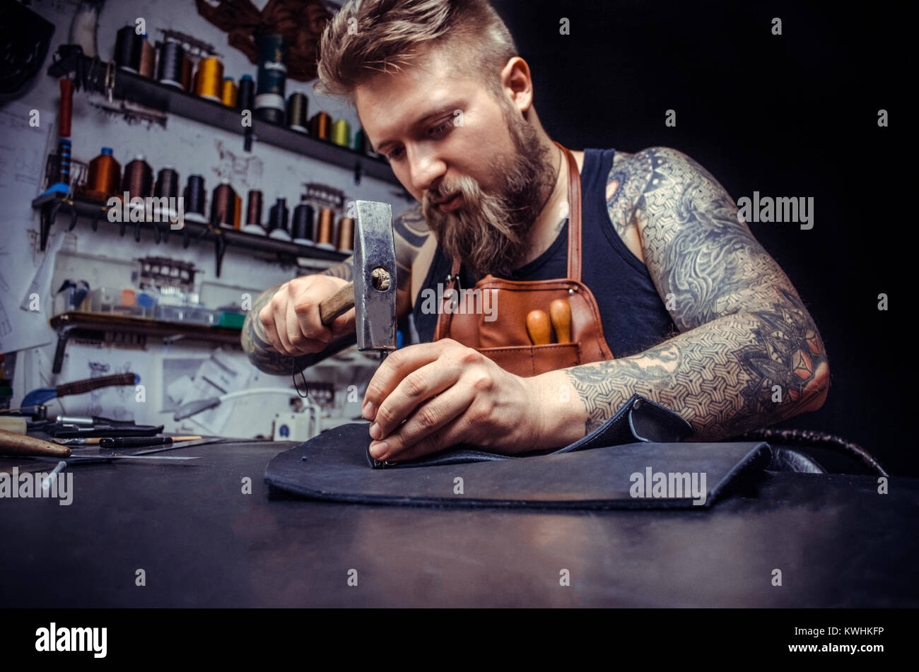 Close up of a shoemaker man working with leather Stock Photo - Alamy