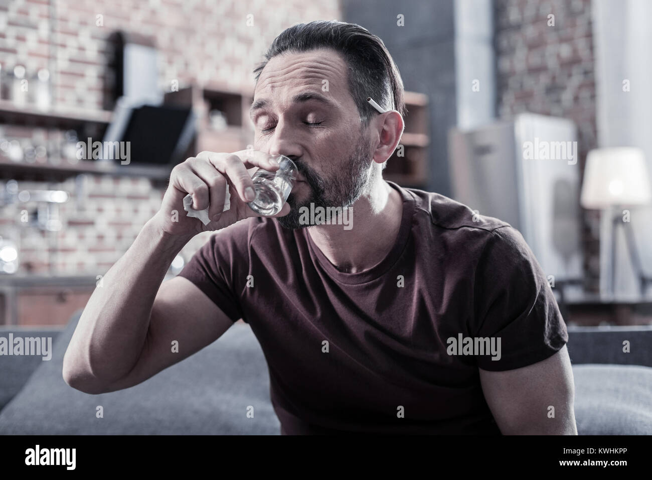 Cheerless unhappy man suffering from depression Stock Photo - Alamy