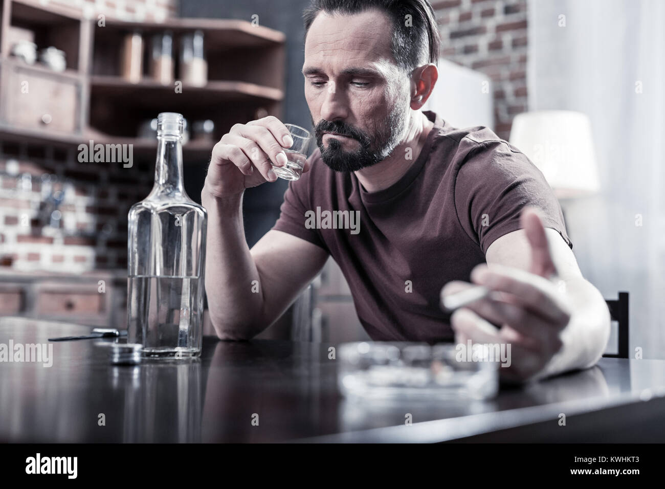 Serious thoughtful man focusing on his problems Stock Photo - Alamy