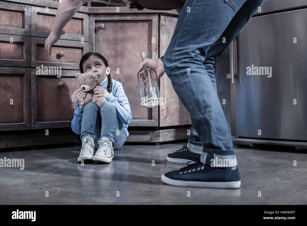 Cute scared girl looking at her father Stock Photo - Alamy