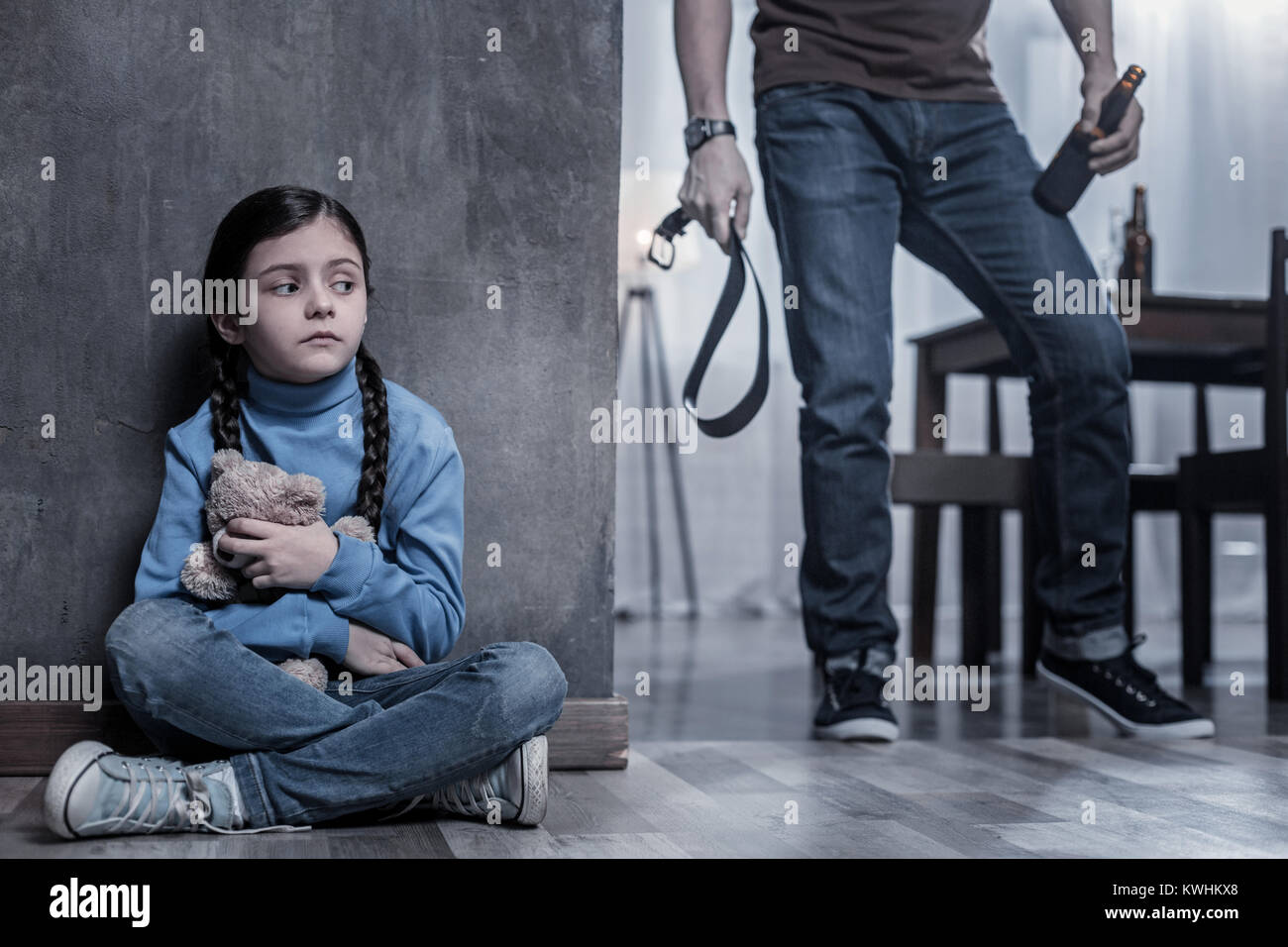 Scared young girl being afraid of her father Stock Photo - Alamy