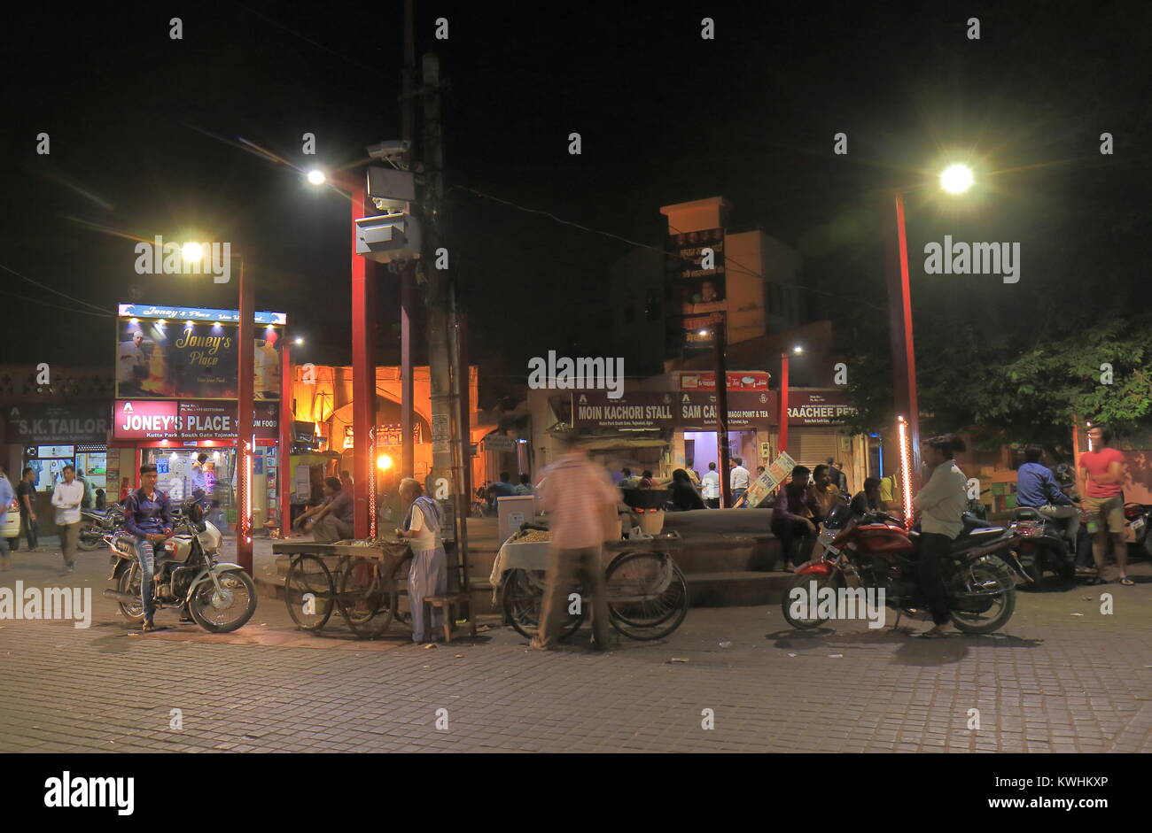 People visit shopping street in downtown Agra India Stock Photo - Alamy