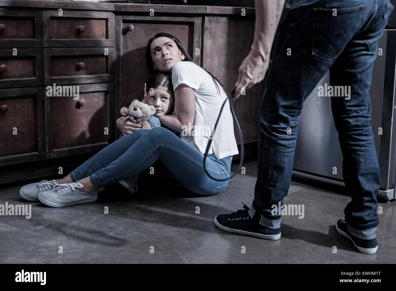 Scared young woman looking at her husband Stock Photo - Alamy