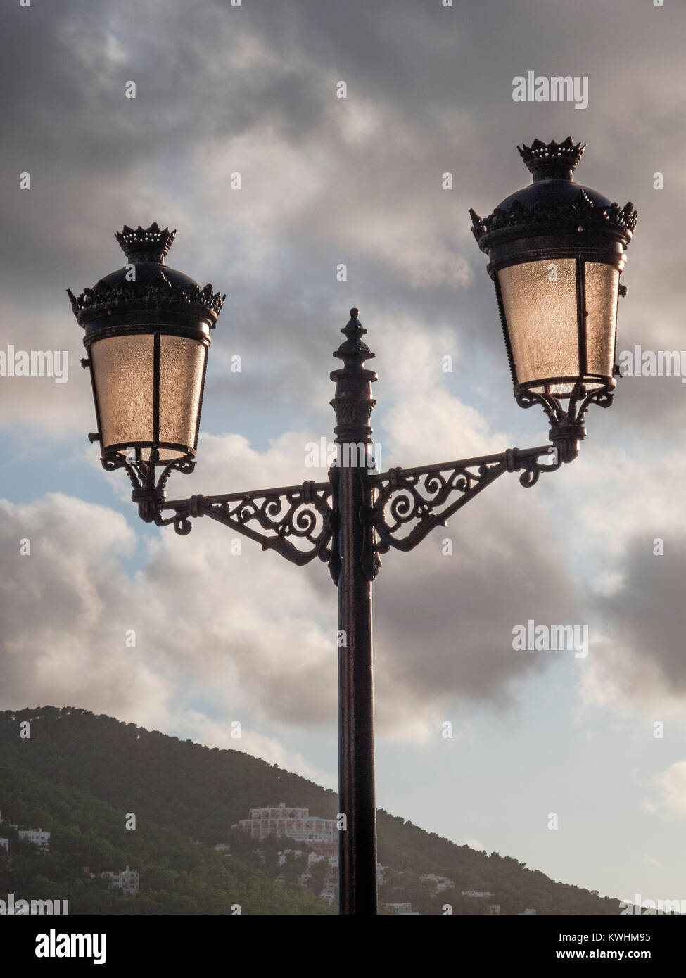 Ornate Lamp post street light close up and back lit during sunset Ibiza ...