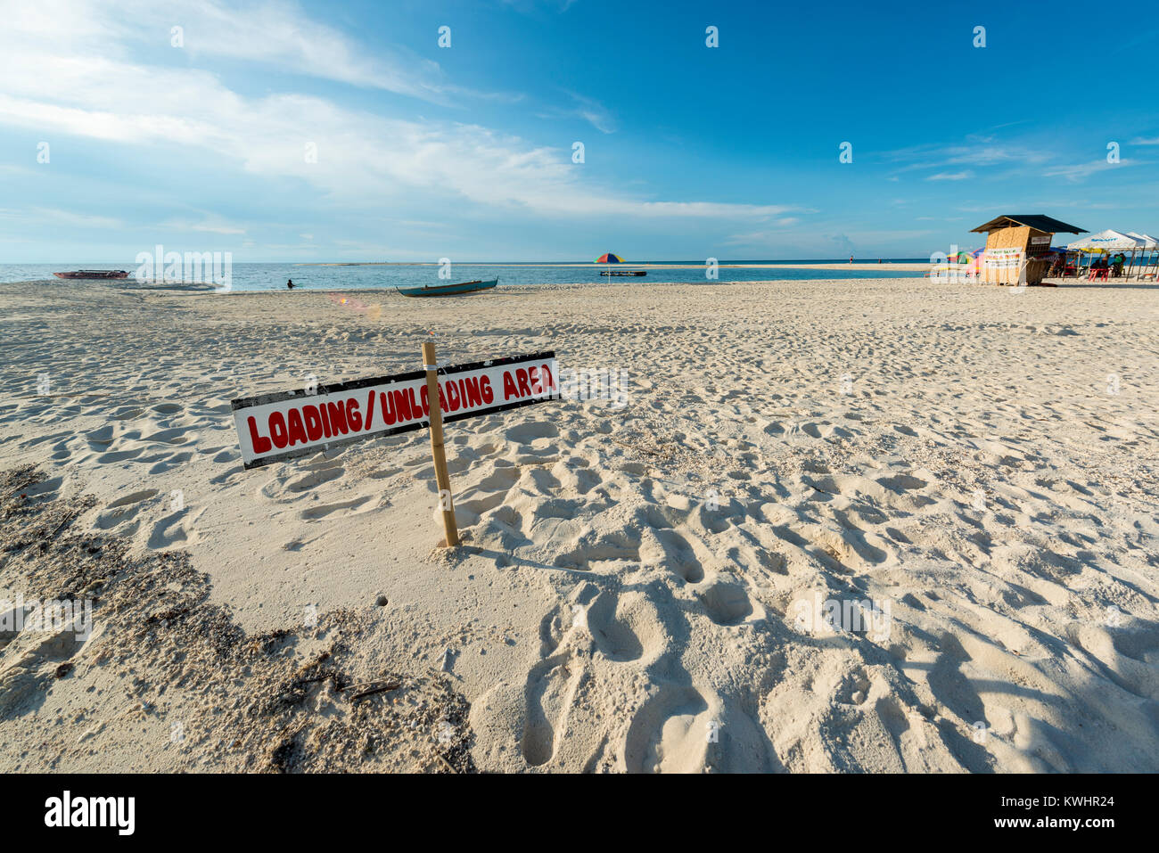 Loading and unloading sign on the beach of a deserted island Stock ...