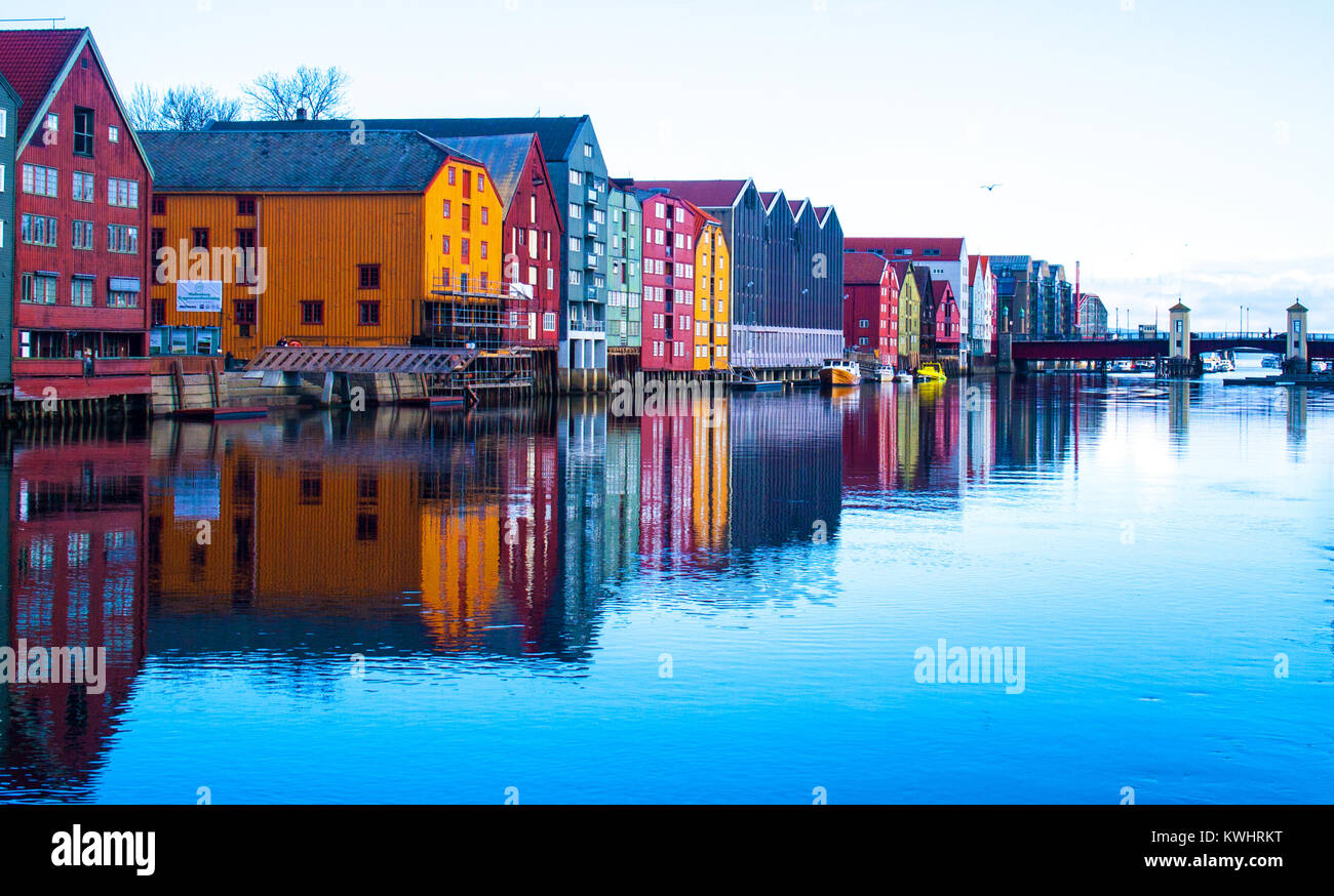 Colourful buildings and bright reflections on Trondheim waterfront ...