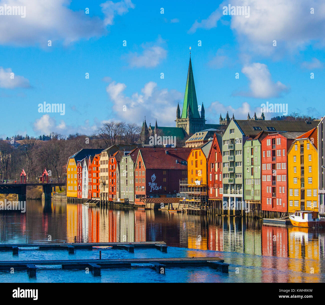 Colourful buildings and bright reflections on Trondheim waterfront ...