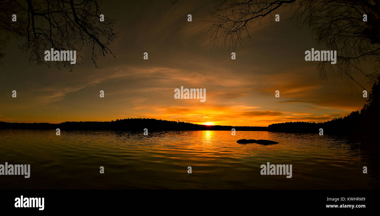 Beautiful colorful sunset reflecting from water surface Stock Photo - Alamy