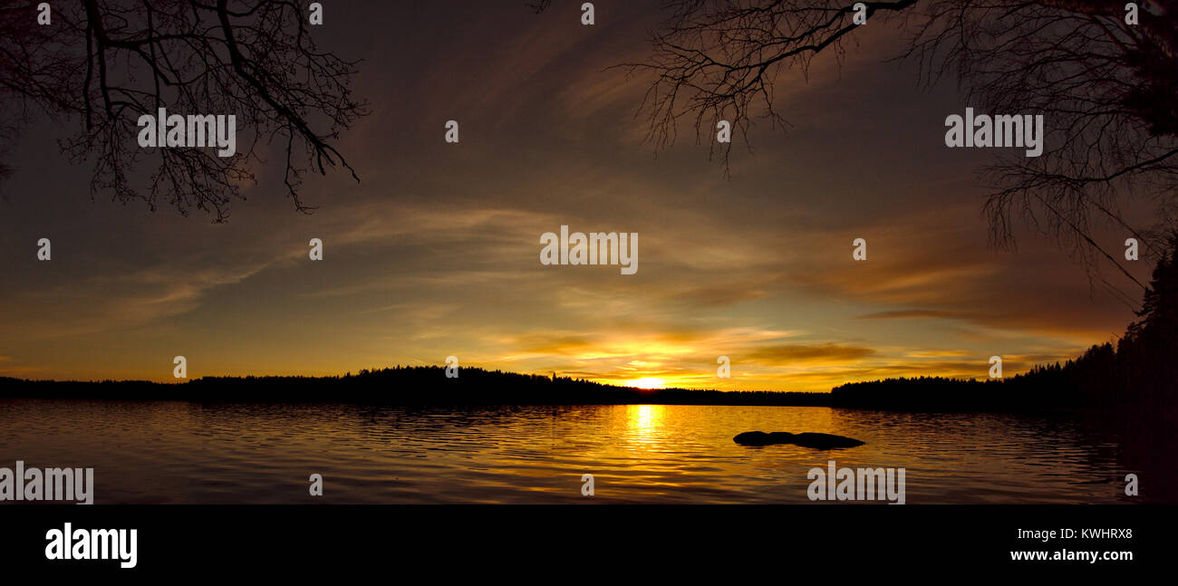 Beautiful colorful sunset reflecting from water surface Stock Photo - Alamy