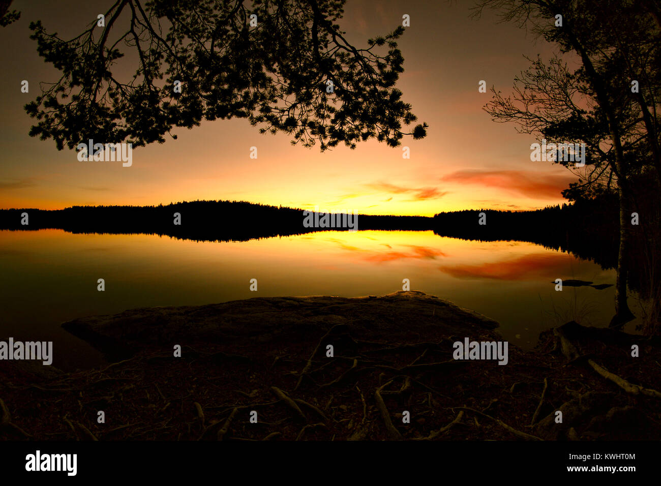 Beautiful colorful sunset reflecting from water surface Stock Photo - Alamy