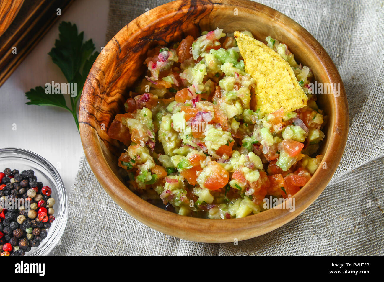 Guacomole is a traditional Mexican sauce consisting of grated avocado ...