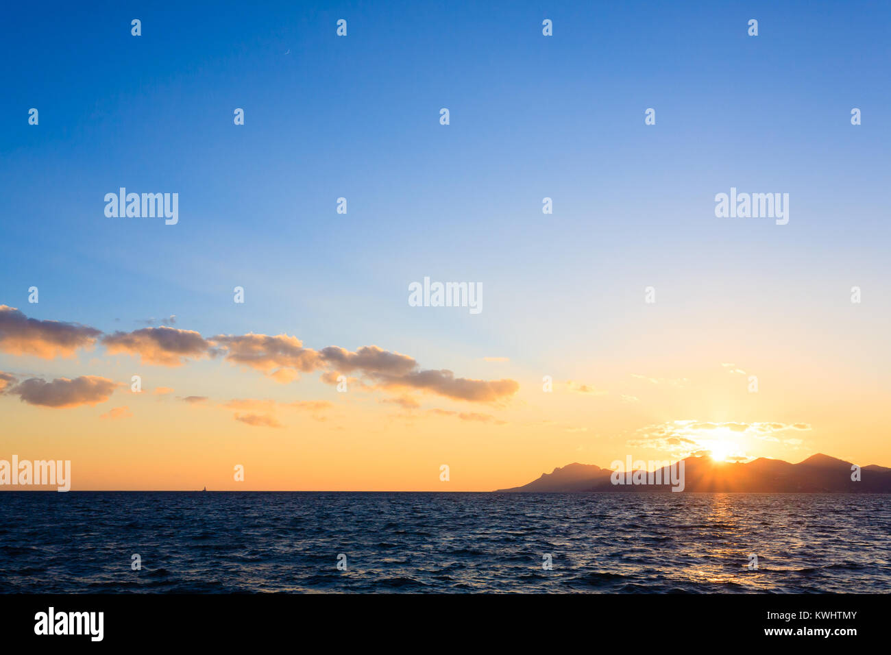 Sunset from the port of Cannes, France. Beautiful french panorama. Sun ...