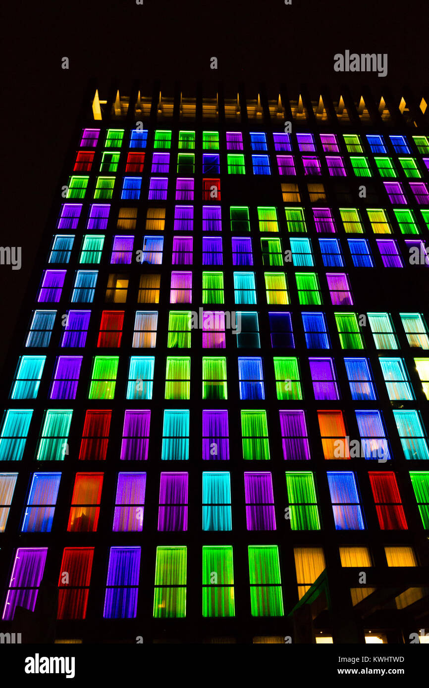 Colored windows texture. Windows illuminated by neon lights background ...