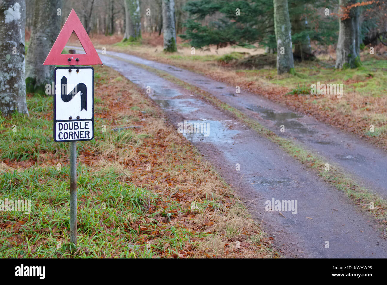 Vintage retro road sign post double bend in rural countryside Stock ...