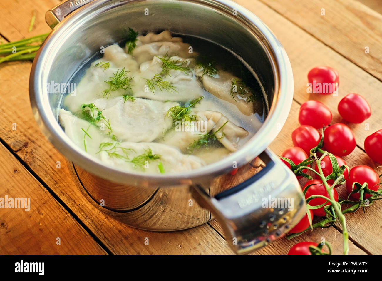 Boiled dumplings with parsley Stock Photo - Alamy