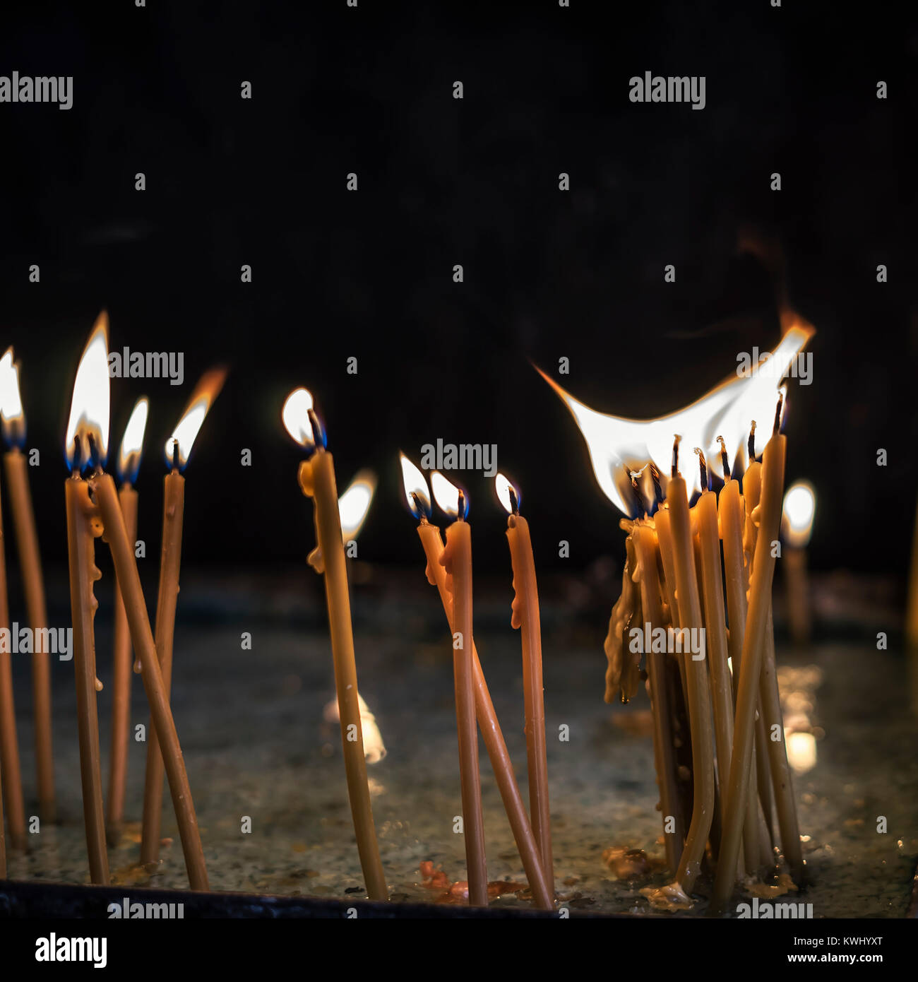 Burning yellow candles hi-res stock photography and images - Alamy
