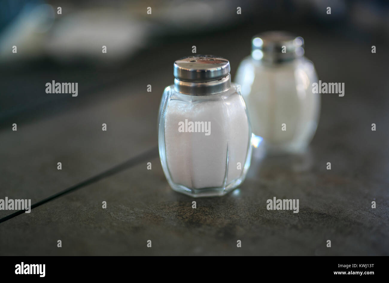 Salt over a wooden table Stock Photo - Alamy