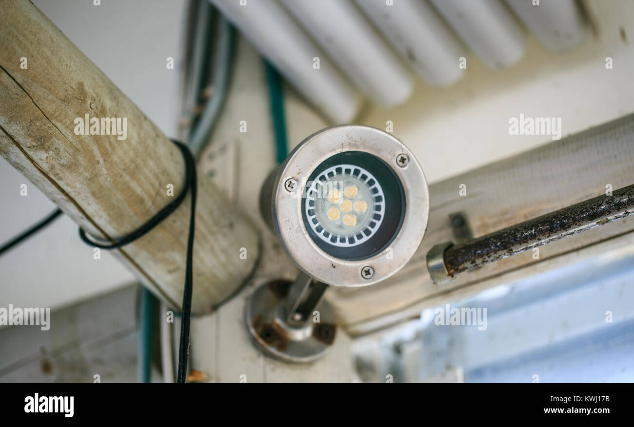 Broken white security camera Stock Photo - Alamy