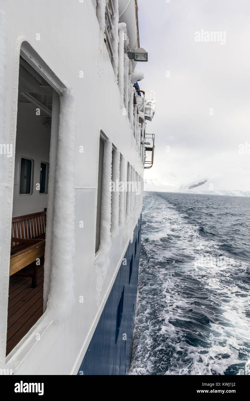 Ice coated windows; passenger ship Ocean Adventurer sails Drake Passage ...