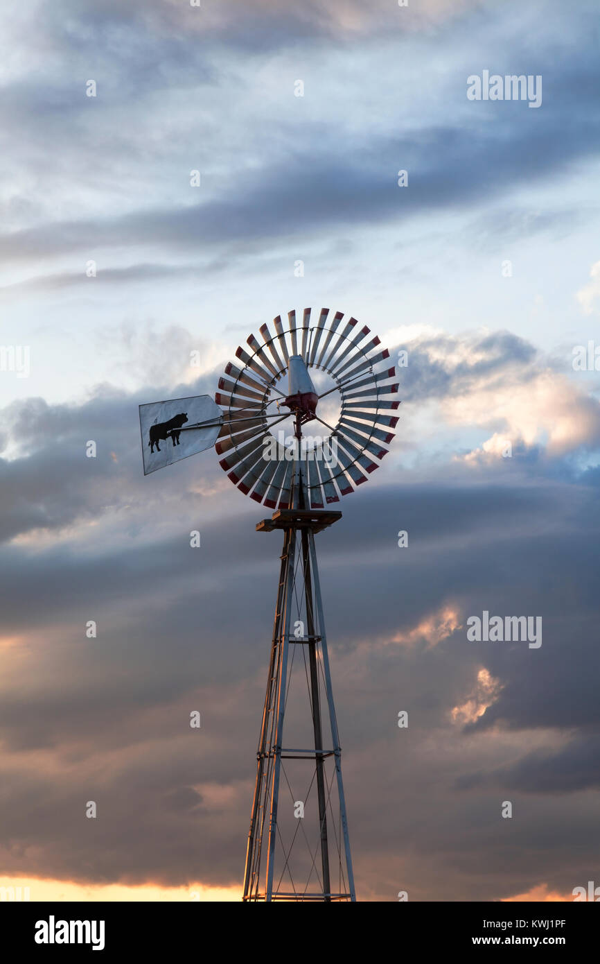 An antique metal windmill against a dramatic sky in Ontario, Canada ...