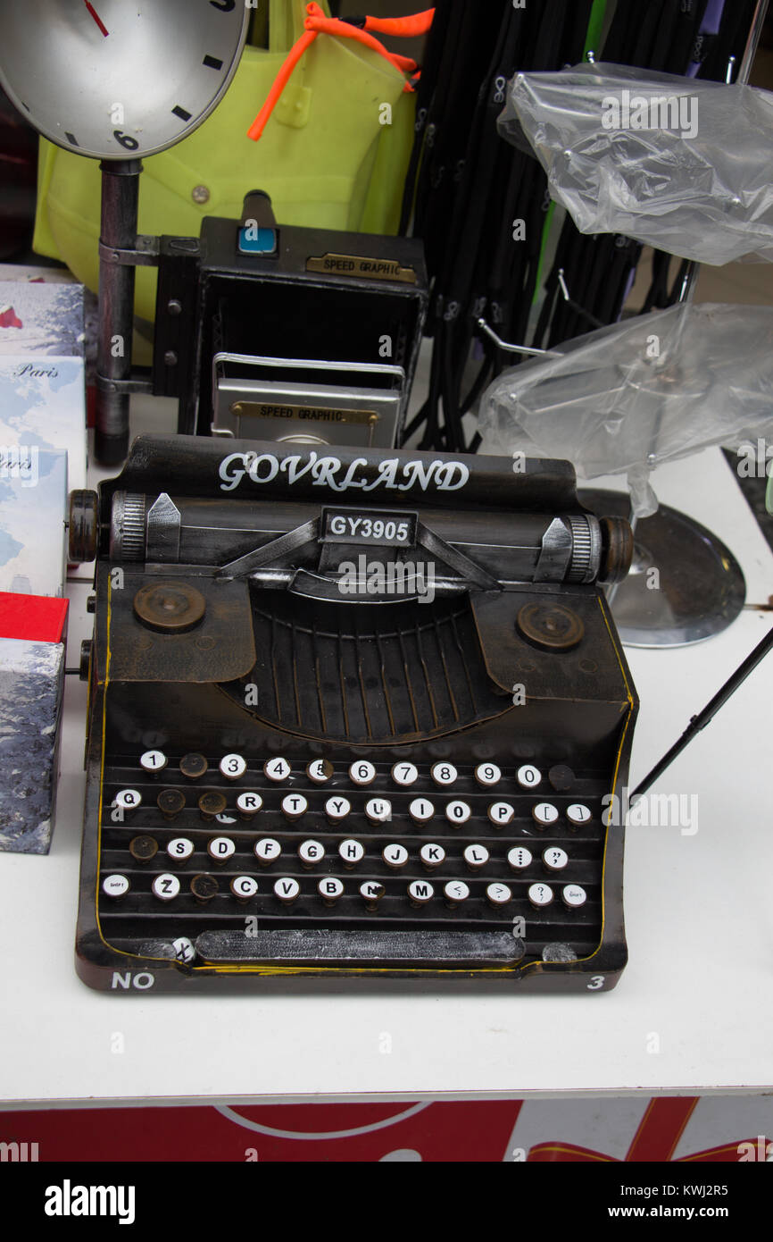 Retro syled tiny typewriter model on a white background Stock Photo - Alamy