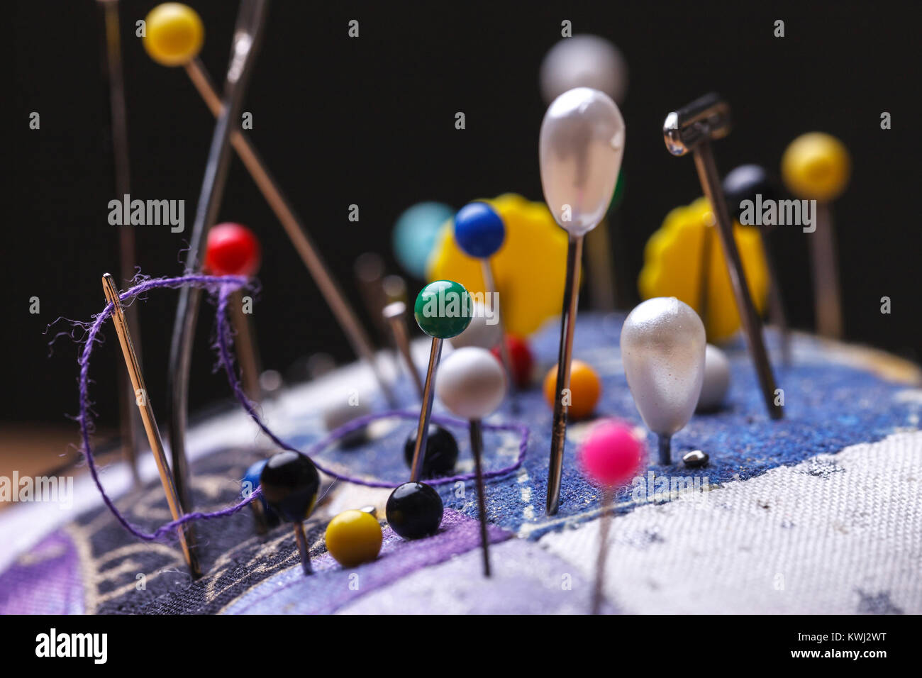 A conceptual image of pins and needles sticking in a pin cushion Stock ...