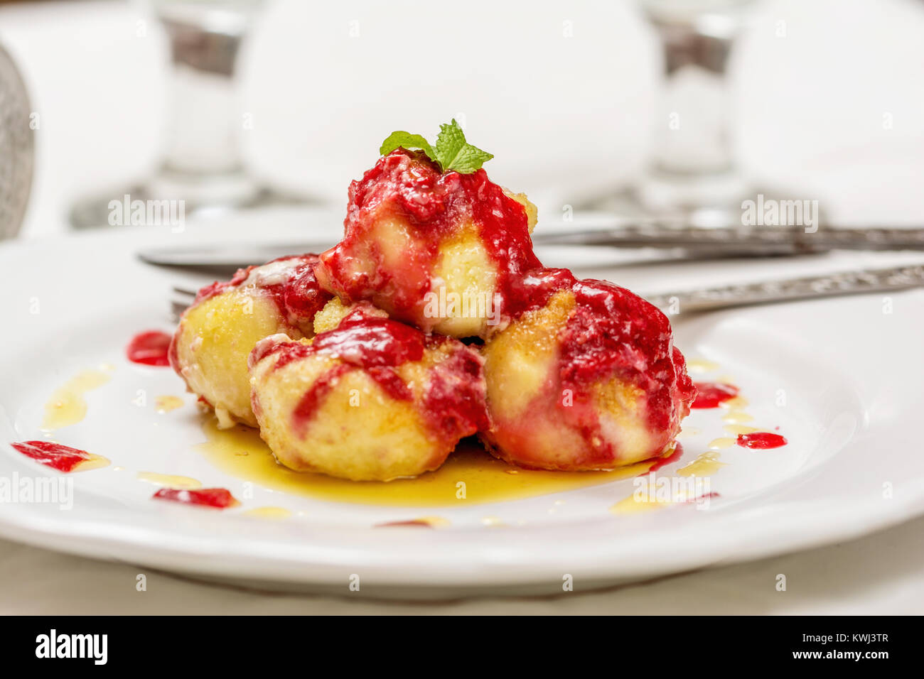 Traditional czech blueberry dumplings with raspberry coulis Stock Photo ...