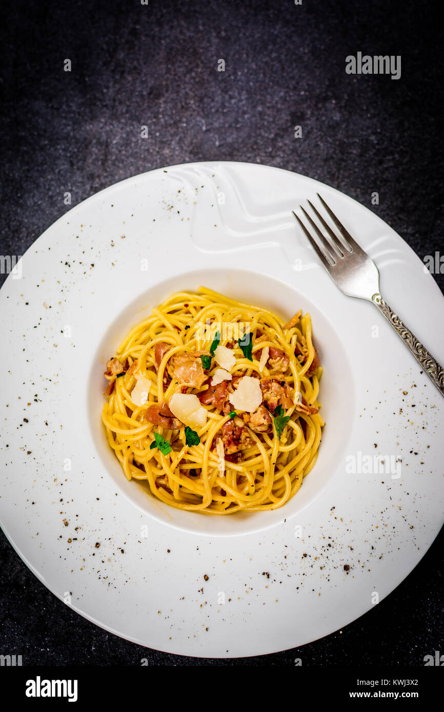 Traditional italian pasta spaghetti carbonara with bacon and cheese ...