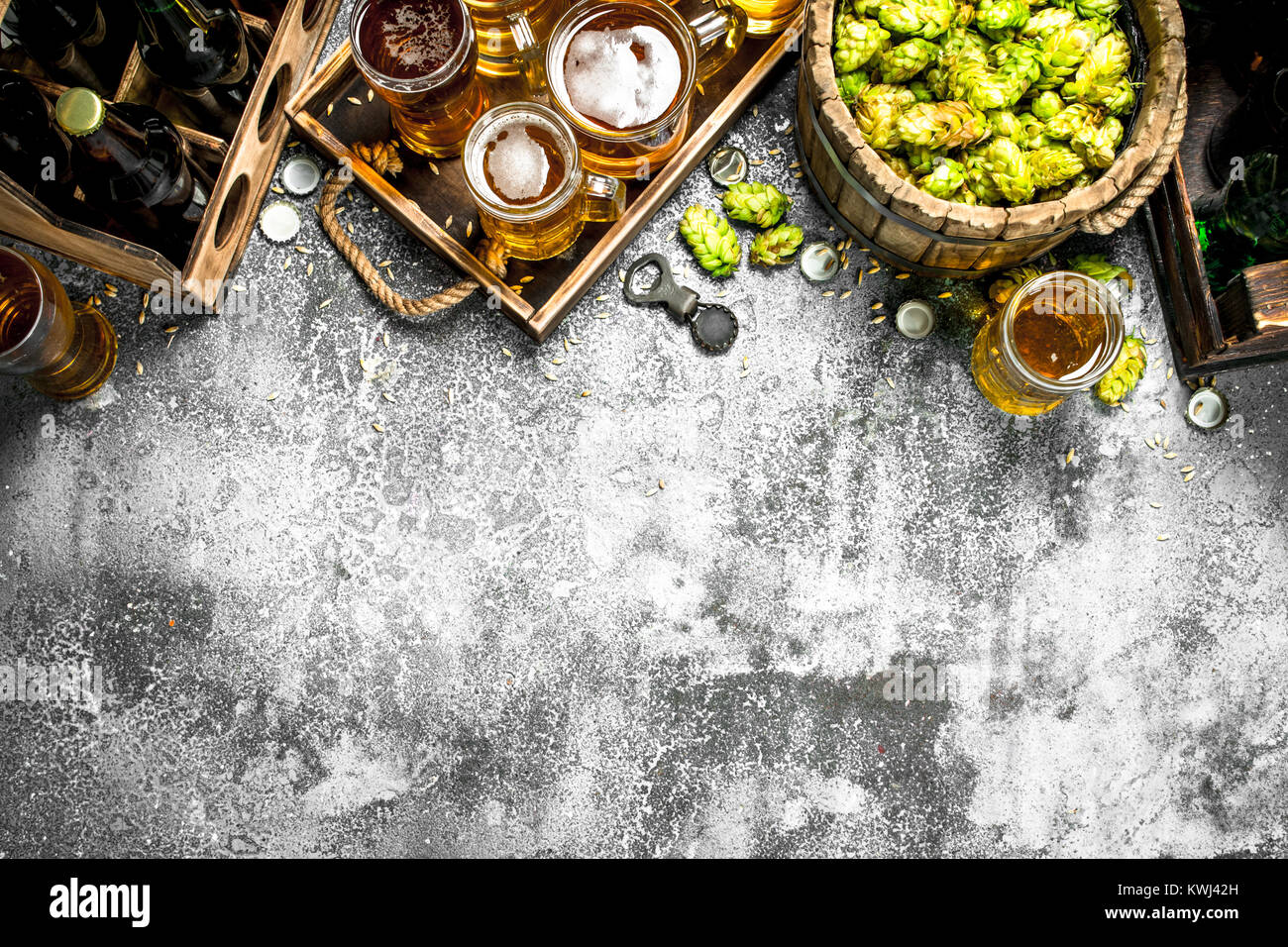 Beer background. Fresh beer with ingredients. On a rustic background ...
