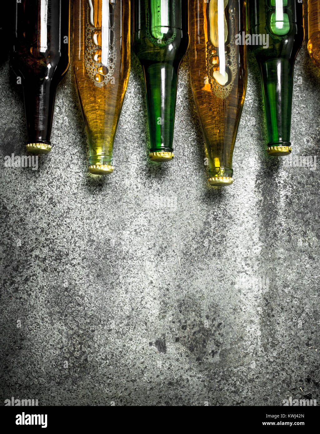 Different bottles of beer. On a rustic background Stock Photo - Alamy