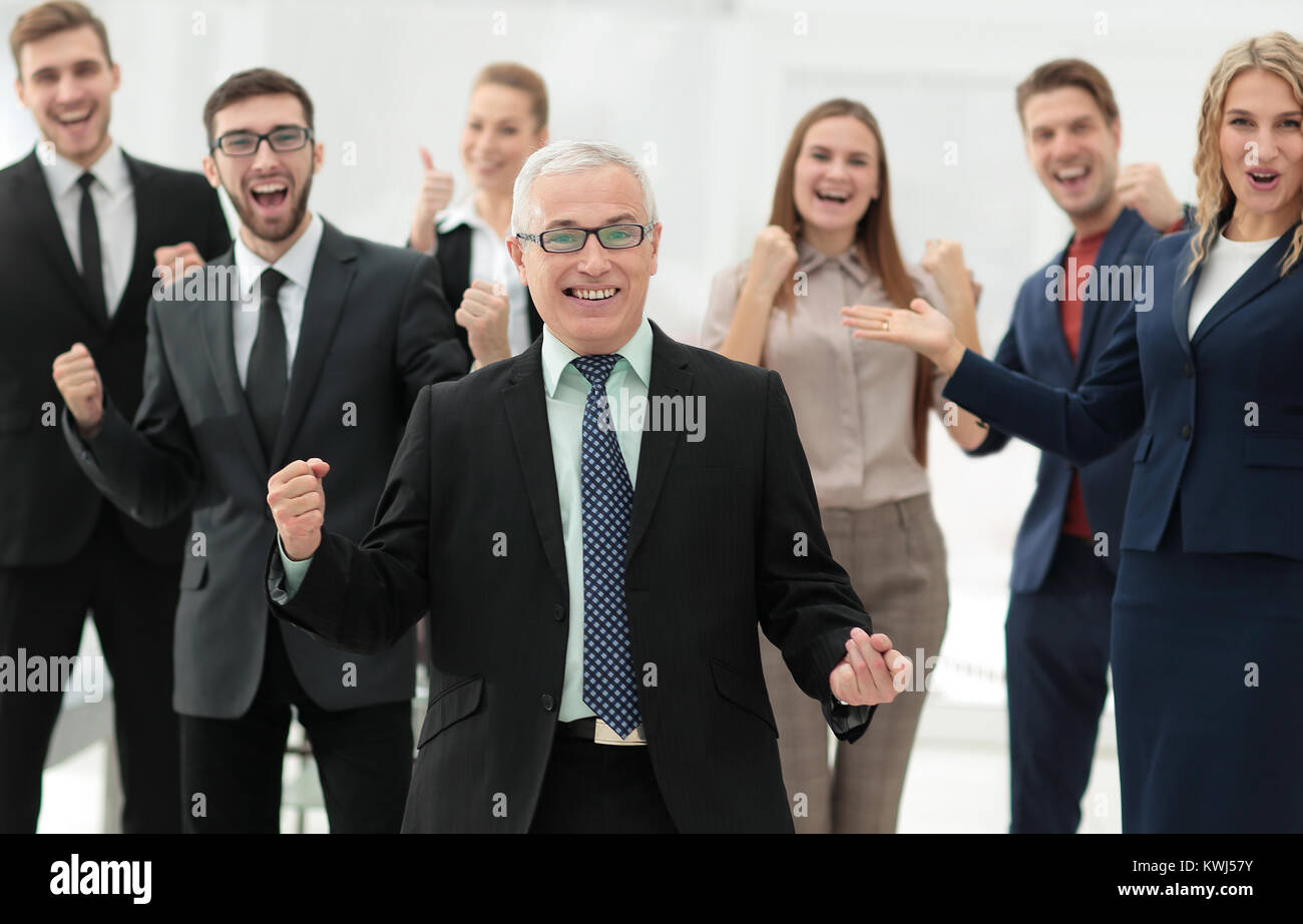 happy senior businessman and triumphant business team Stock Photo - Alamy