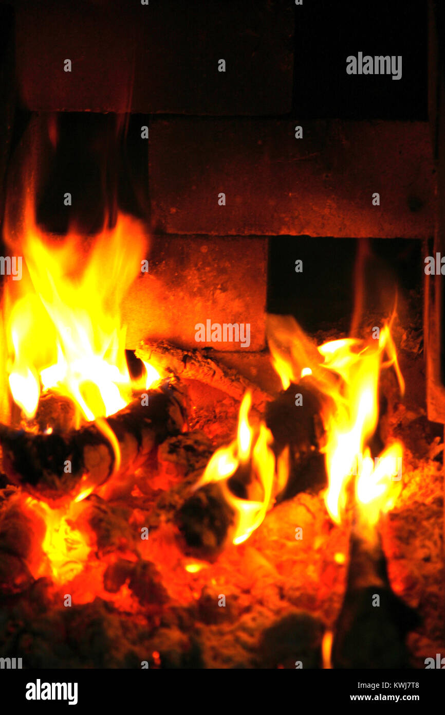 Fire burning in fireplace Stock Photo - Alamy