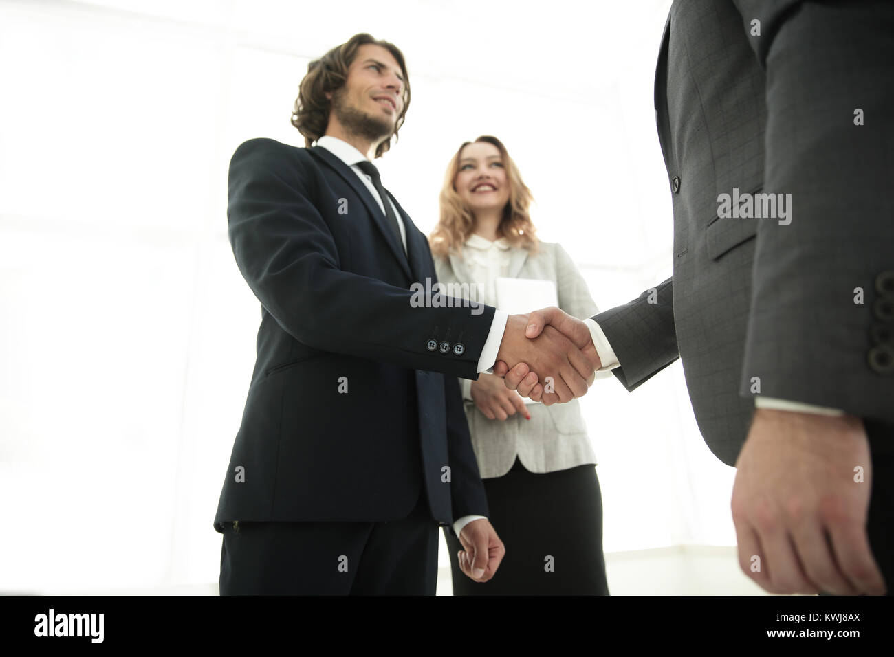 Photo of handshake of two happy businessmen Stock Photo - Alamy
