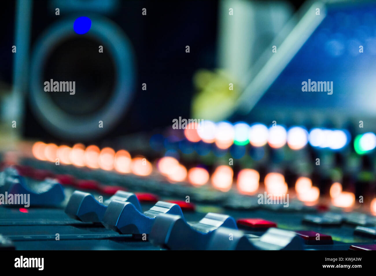 detail of a music mixer in studio with editing tools on blur speaker Stock Photo - Alamy
