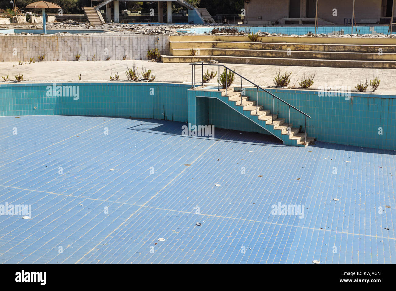 A swimming pool empties and damage at the end of tourist season Stock ...