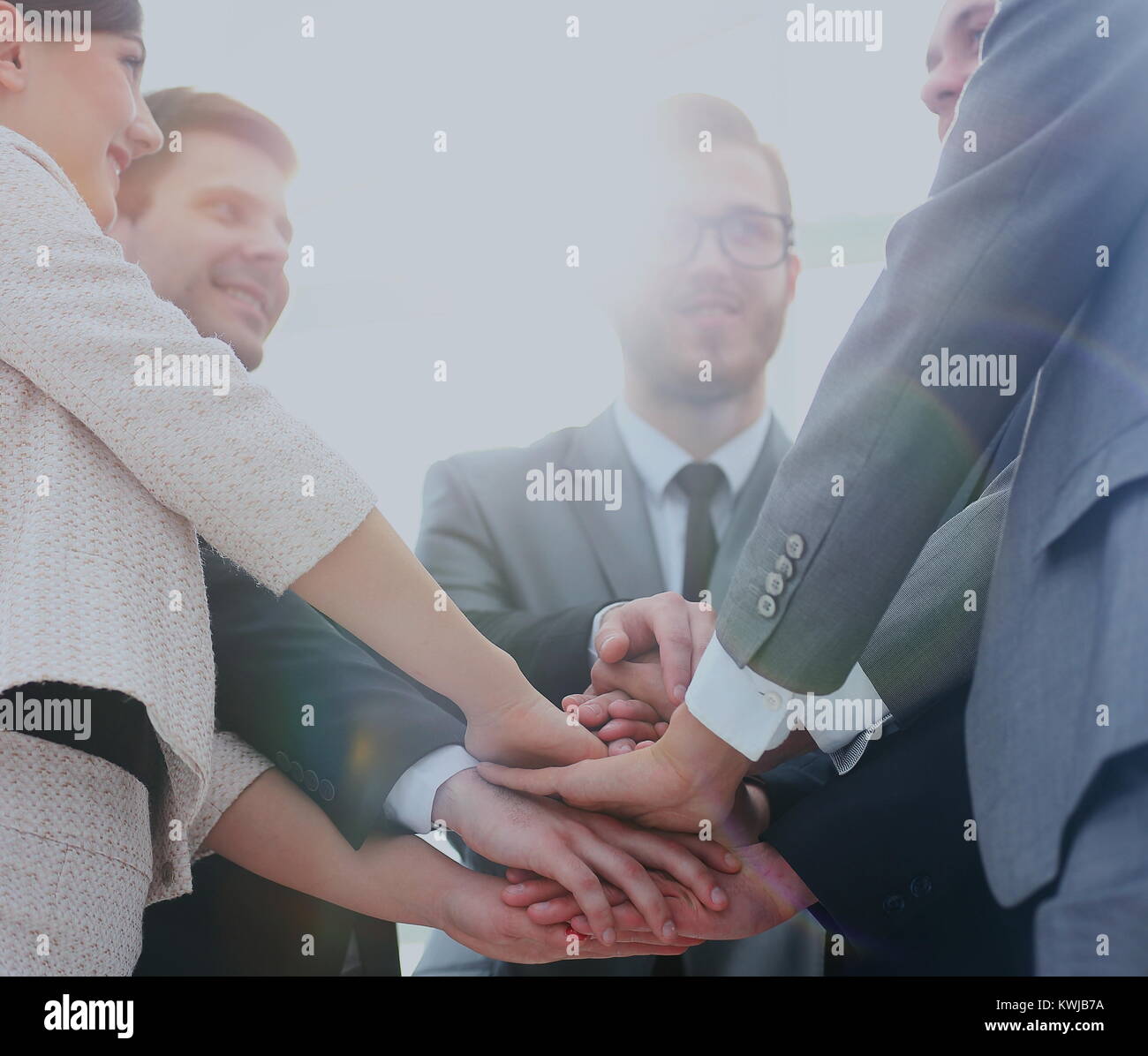 people putting their hands together Stock Photo - Alamy