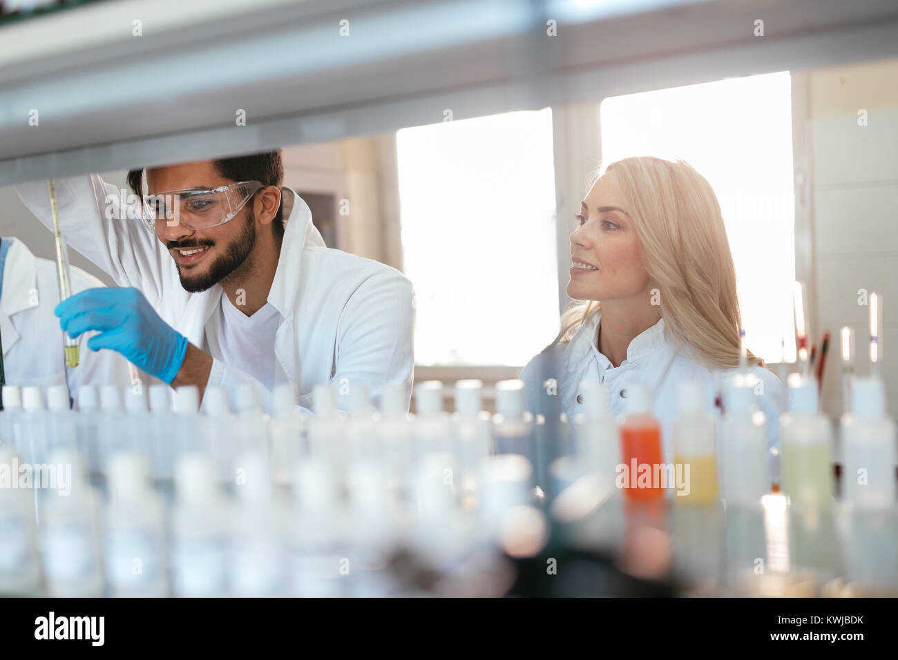 Group of students working at the laboratory Stock Photo - Alamy