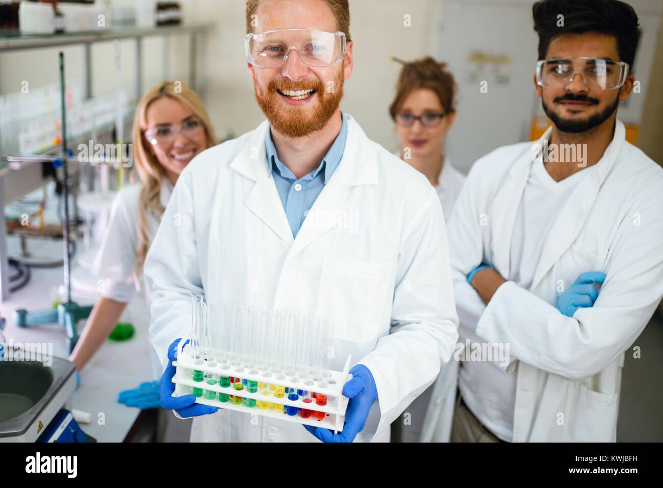 Group of scientists working at laboratory Stock Photo - Alamy
