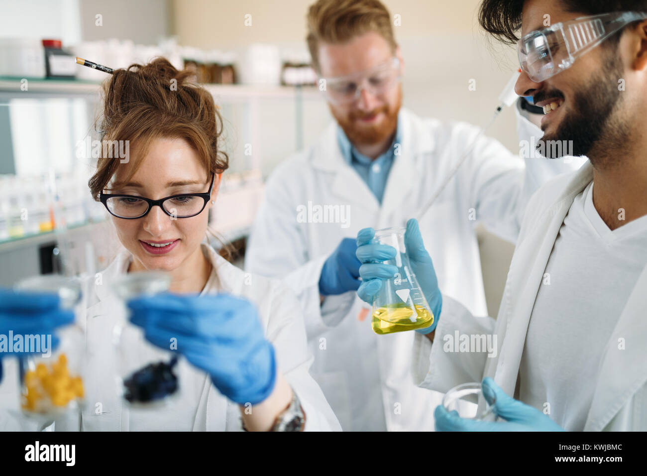 Group of scientists working at laboratory Stock Photo - Alamy