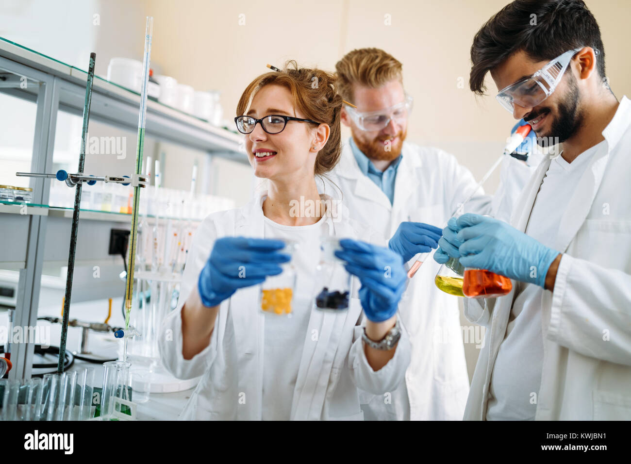Group of students working at the laboratory Stock Photo - Alamy